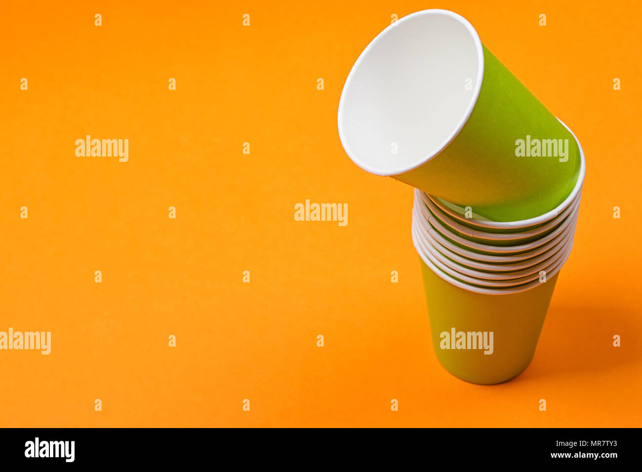 recycling colorful paper glass on the orange background Stock Photo - Alamy