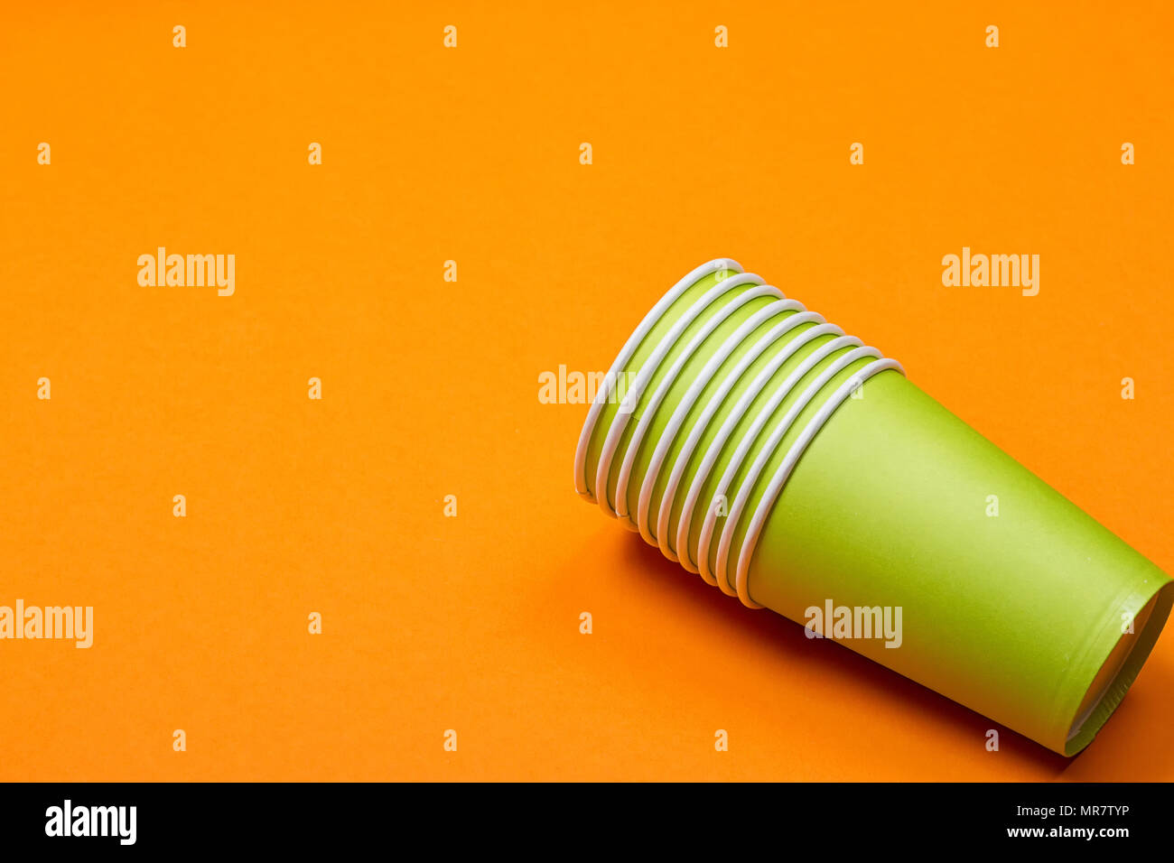 recycling colorful paper glass on the orange background Stock Photo - Alamy