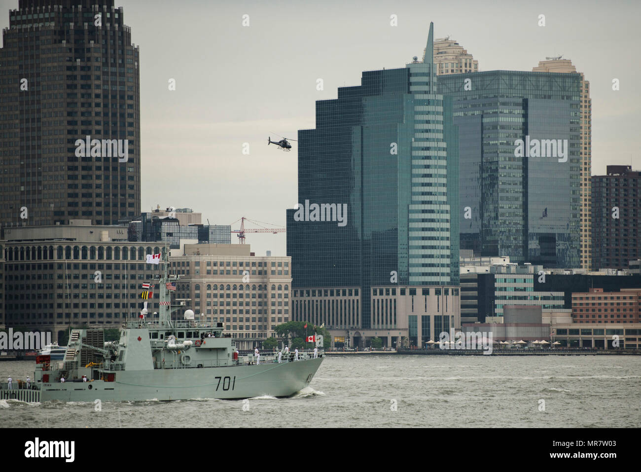 Her Majesty’s Canadian Ship Glace Bay (MM 701) passes the city skyline ...