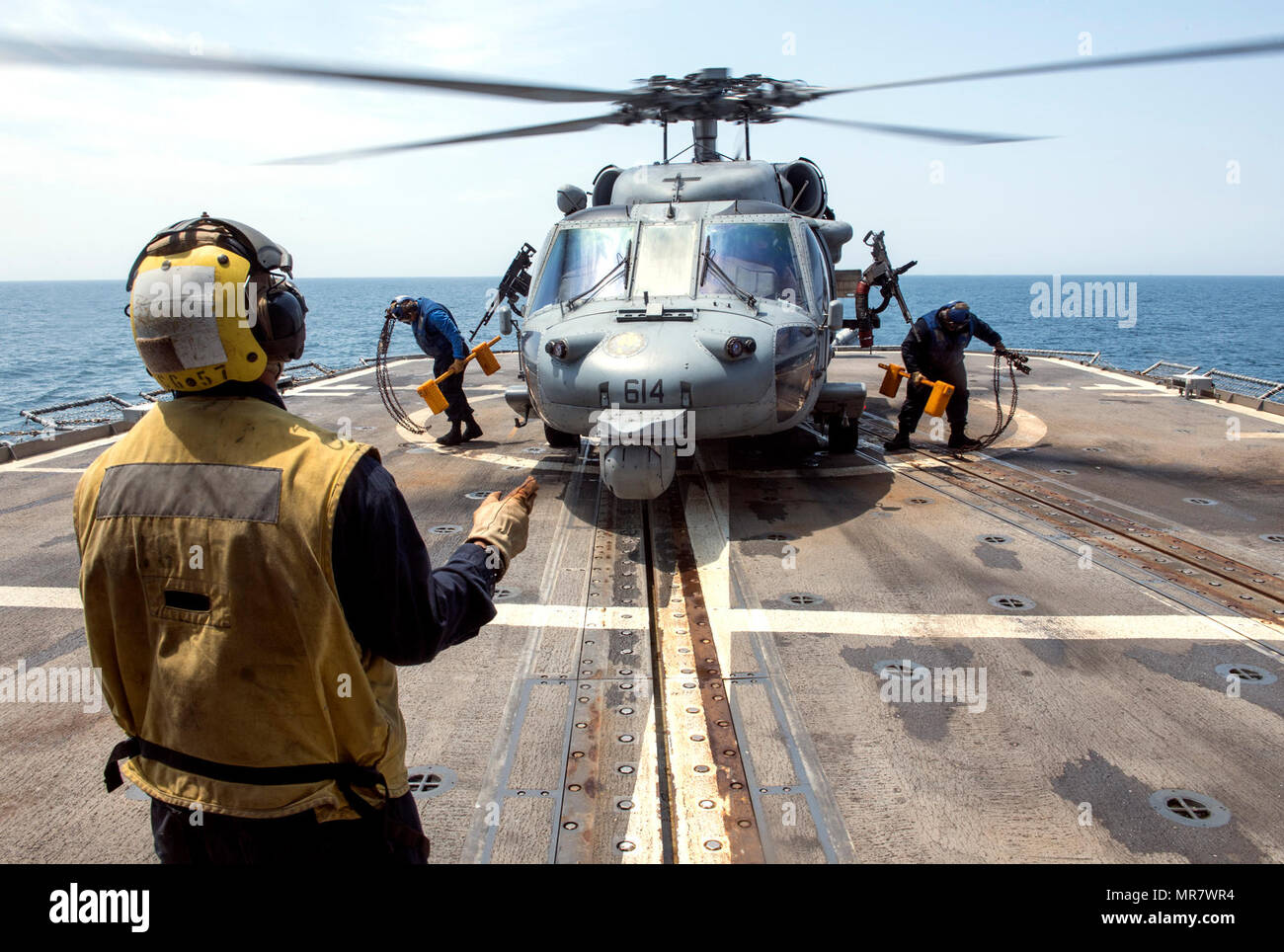 170516-N-FT178-042 WESTERN PACIFIC (May 16, 2017) Sailors remove chocks ...