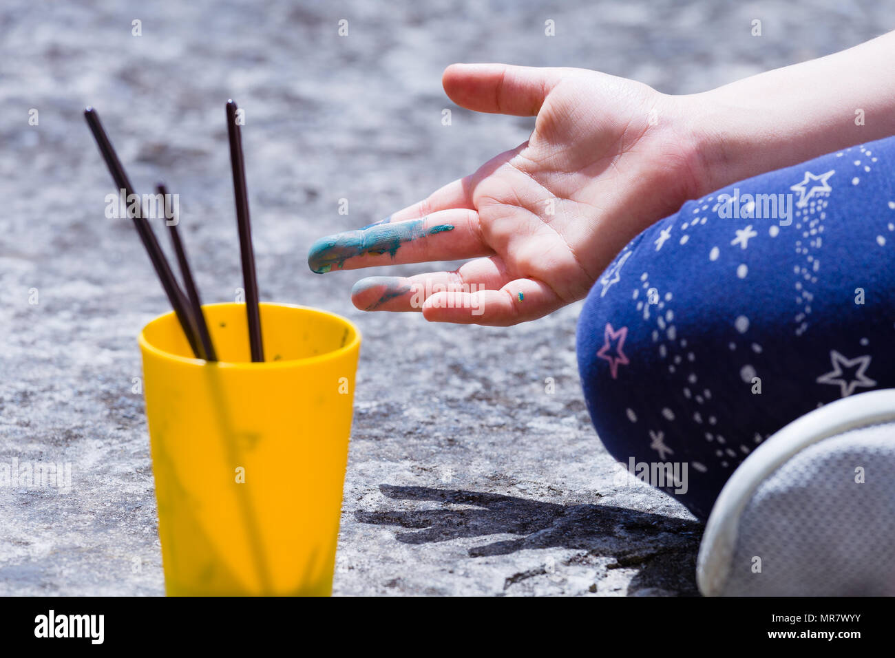 A messy kid hand with watercolor Stock Photo - Alamy