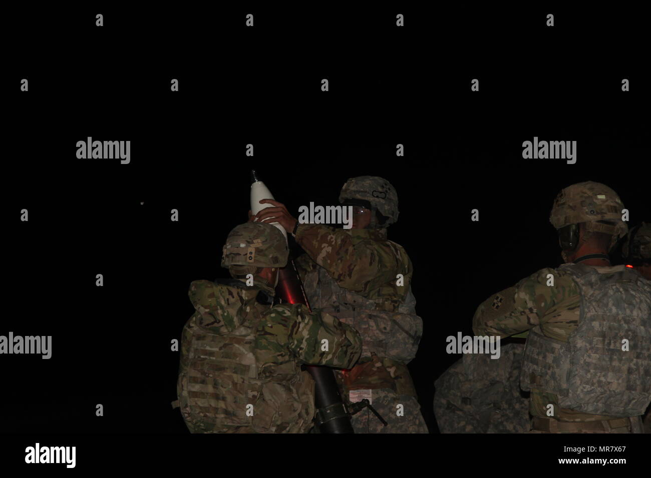 In the dead of night, mortar platoon Soldiers from Headquarters and ...