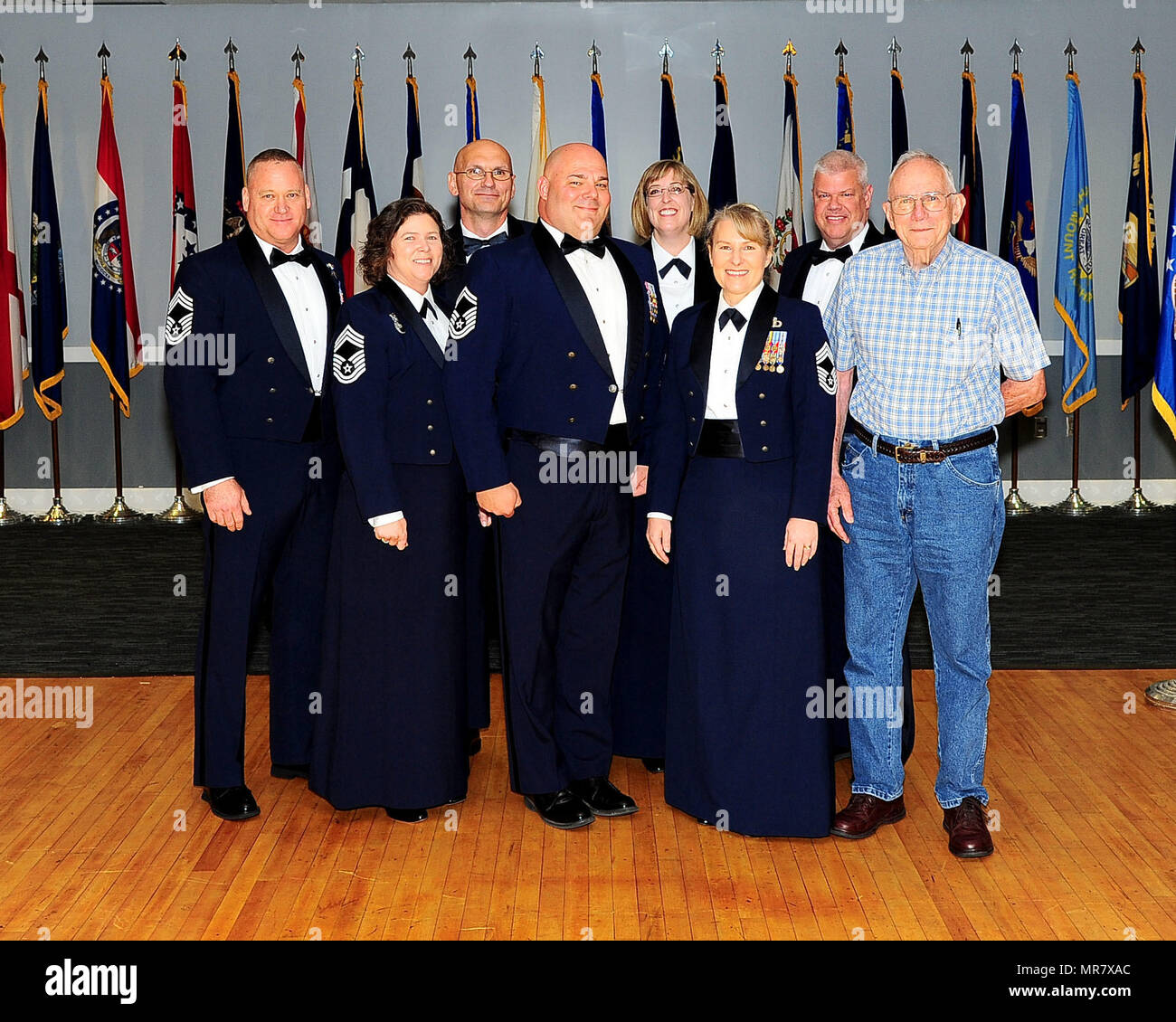Senior Master Sgt. Gary Kimes stands with multiple chief master ...