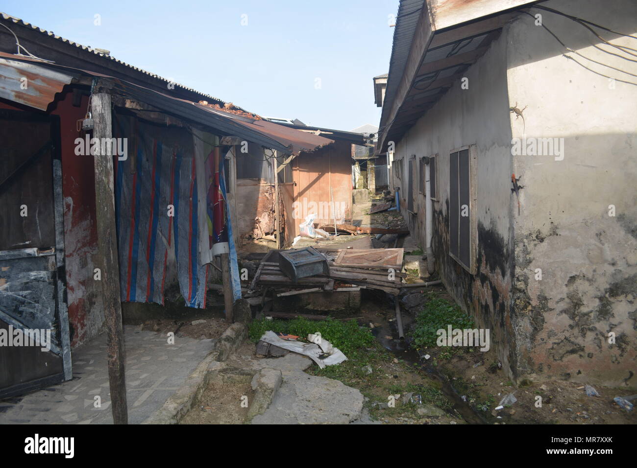 a walk path of a poor community Stock Photo - Alamy