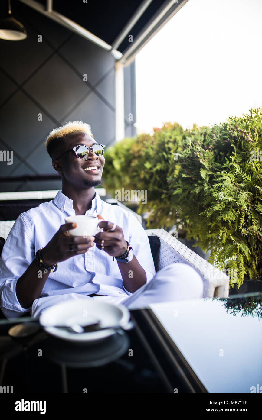 Newspaper man coffeeshop hi-res stock photography and images - Alamy