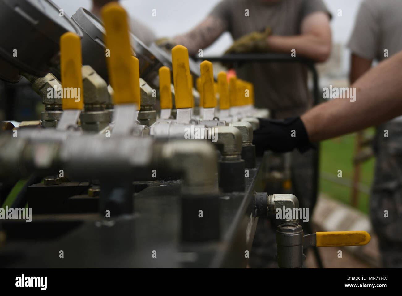 Airmen from 2nd Maintenance Group use an air manifold during an ...