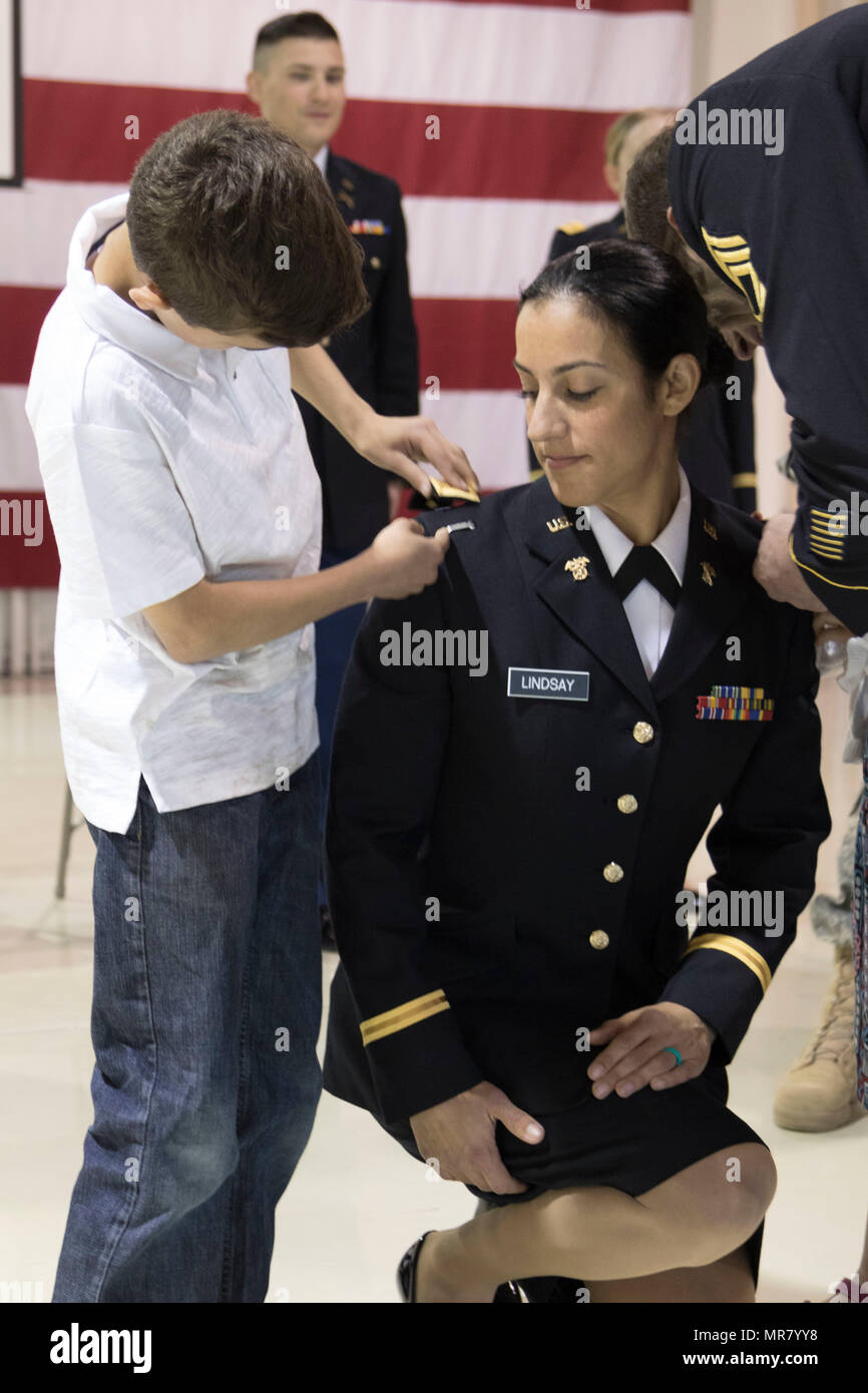 Officer Candidate Marisa Lindsay gets pinned by her son Liam, 10 ...