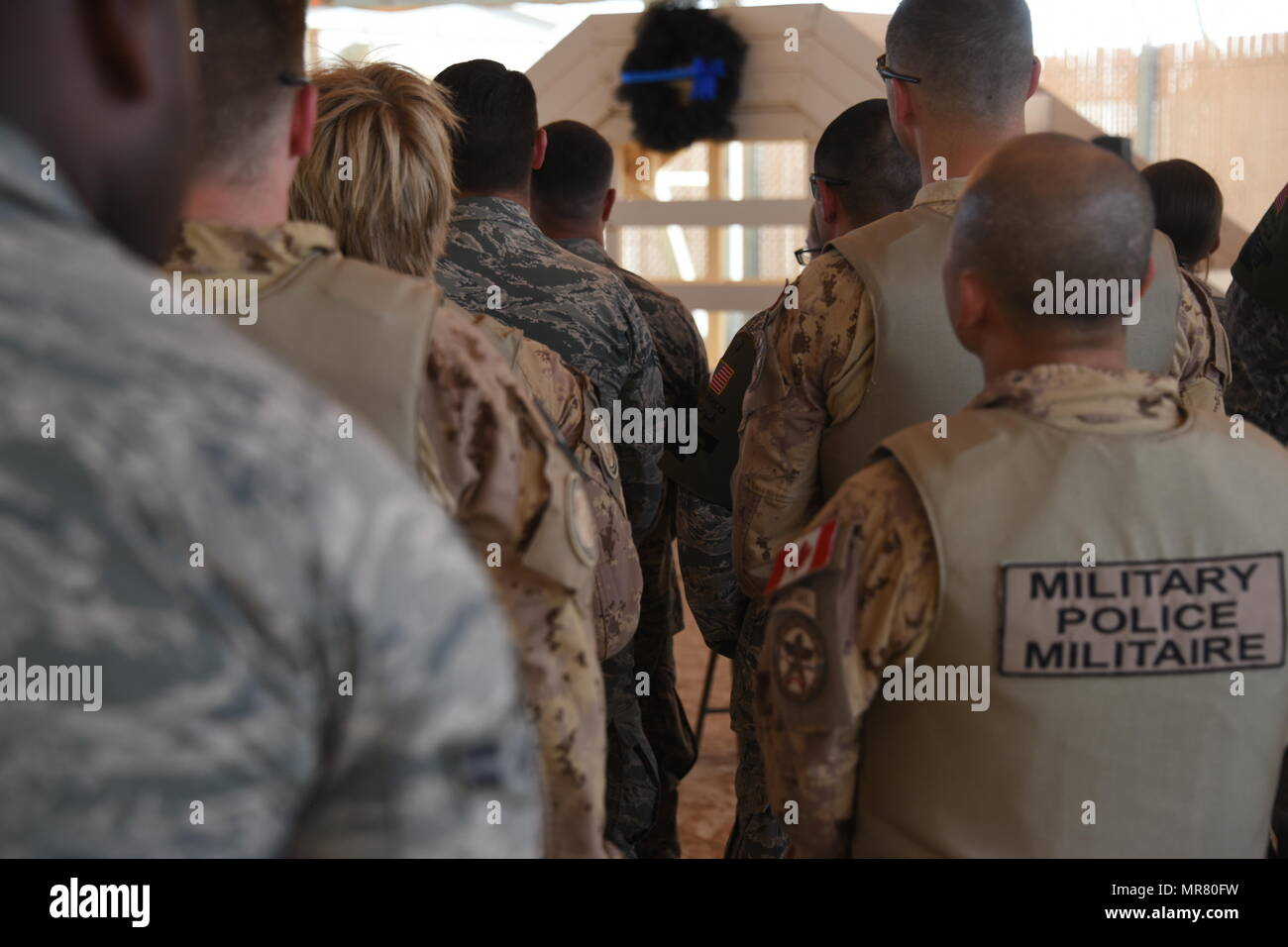 Canadian and American military police members stand together during the ...