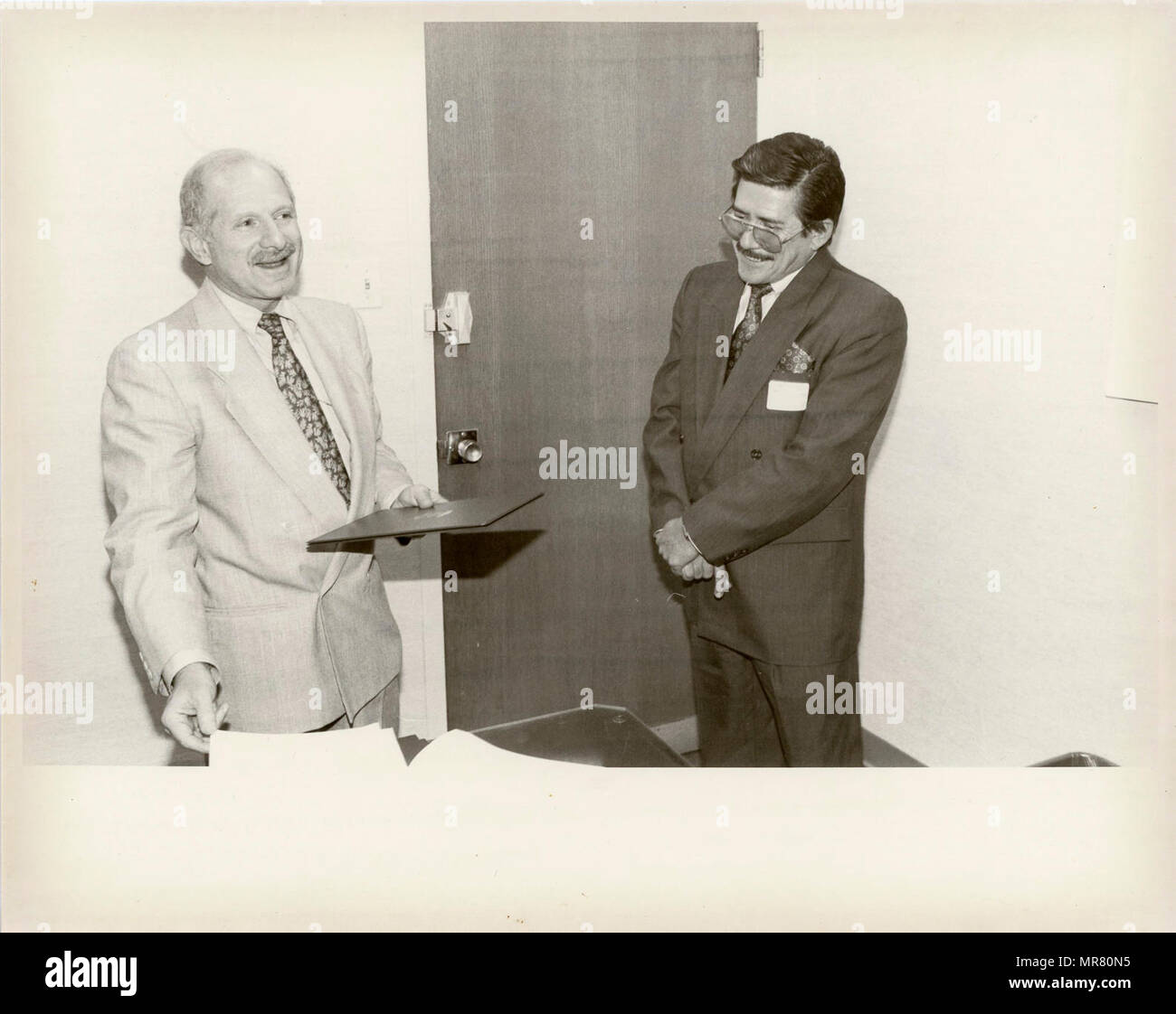 Admin. Atwood presenting general awards - Man giving out award Stock ...