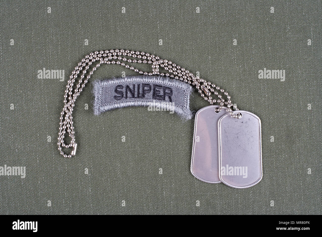 KIEV, UKRAINE - August 21, 2015. US ARMY sniper tab with dog tag and ...