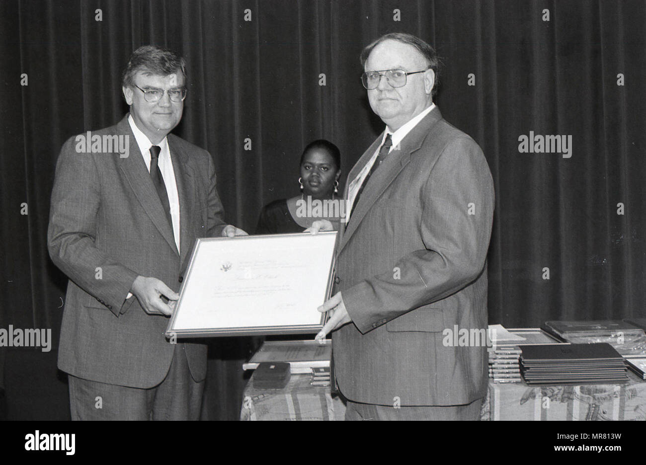 Admin. Atwood presenting general awards - Man receiving award on stage ...