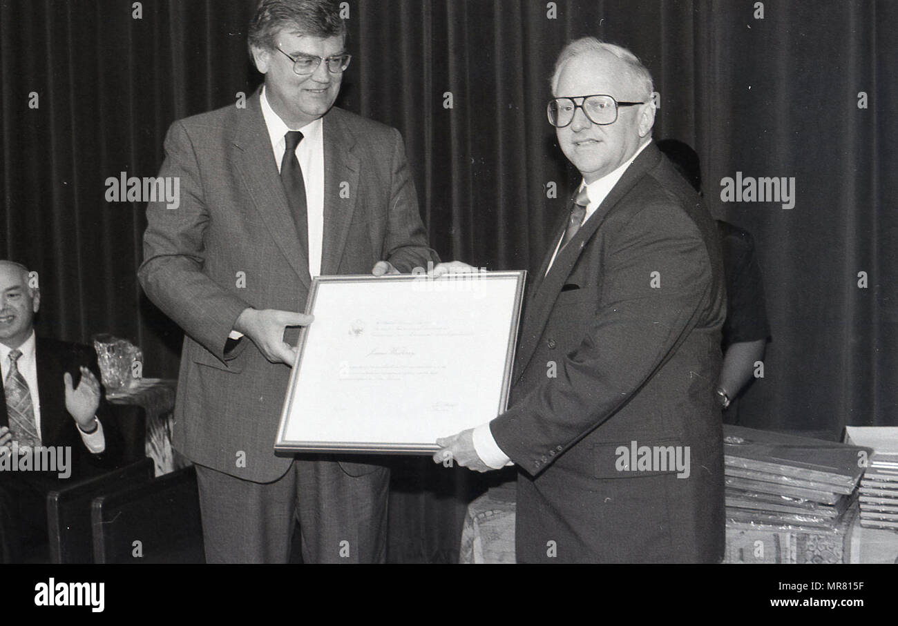 Admin. Atwood presenting general awards - Man receiving award on stage ...