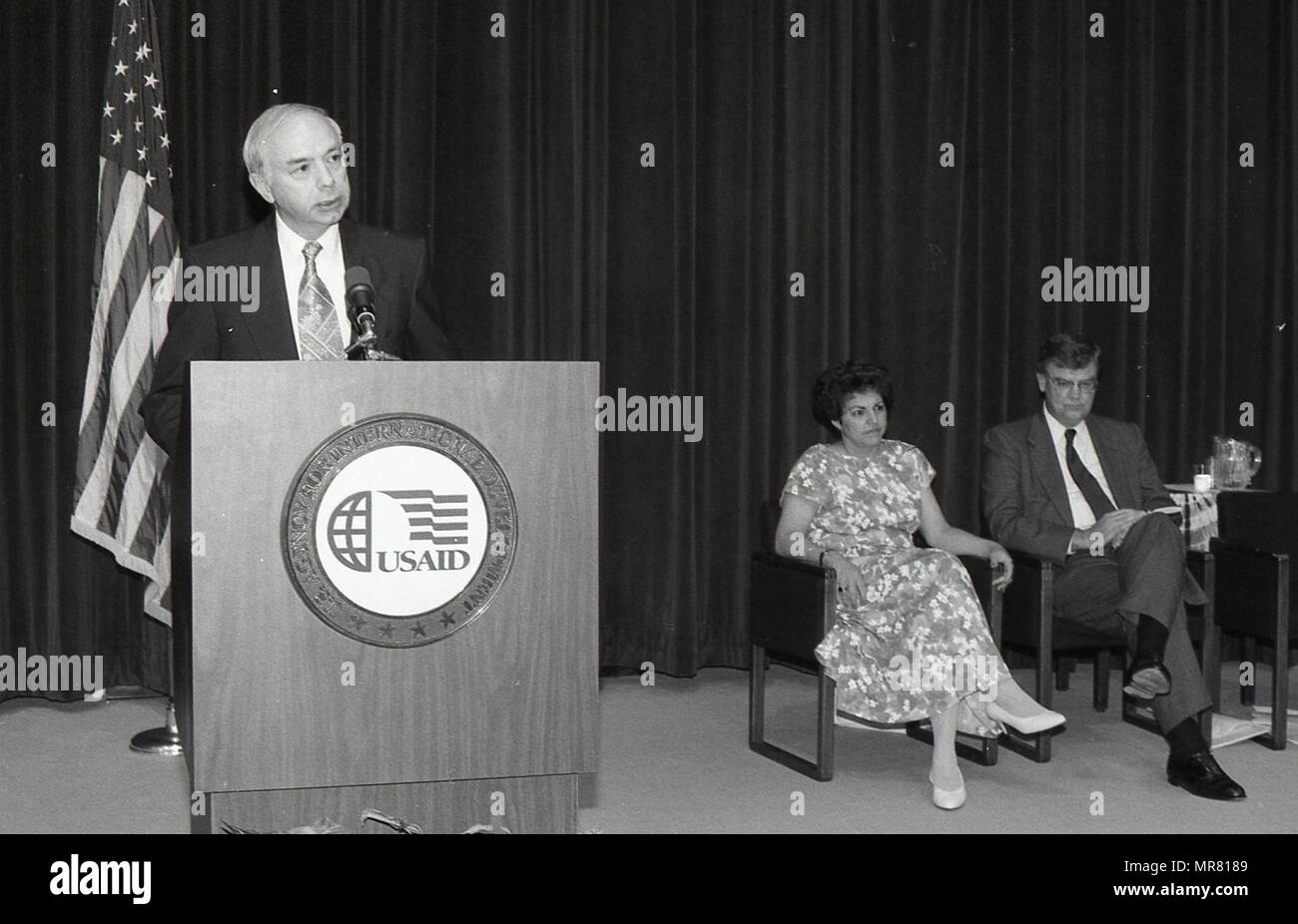 Admin. Atwood presenting general awards - Man speaking at podium Stock ...