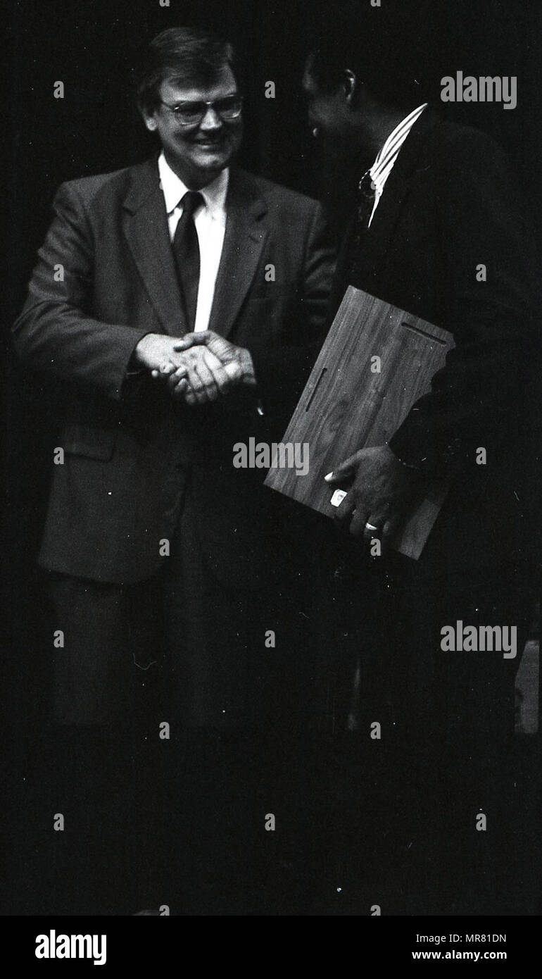 Admin. Atwood presenting general awards - Man receiving award on stage ...