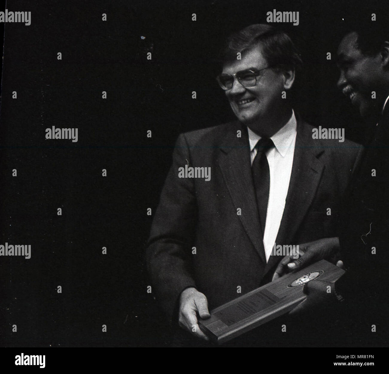 Admin. Atwood presenting general awards - Man receiving award on stage ...