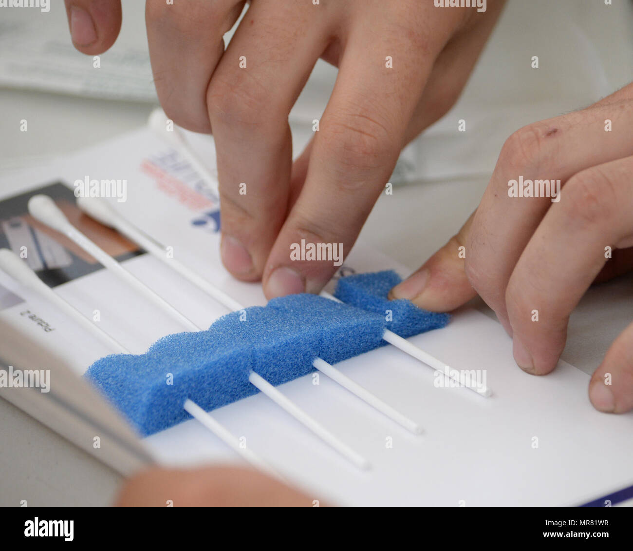 Swabbing cheek hi-res stock photography and images - Alamy