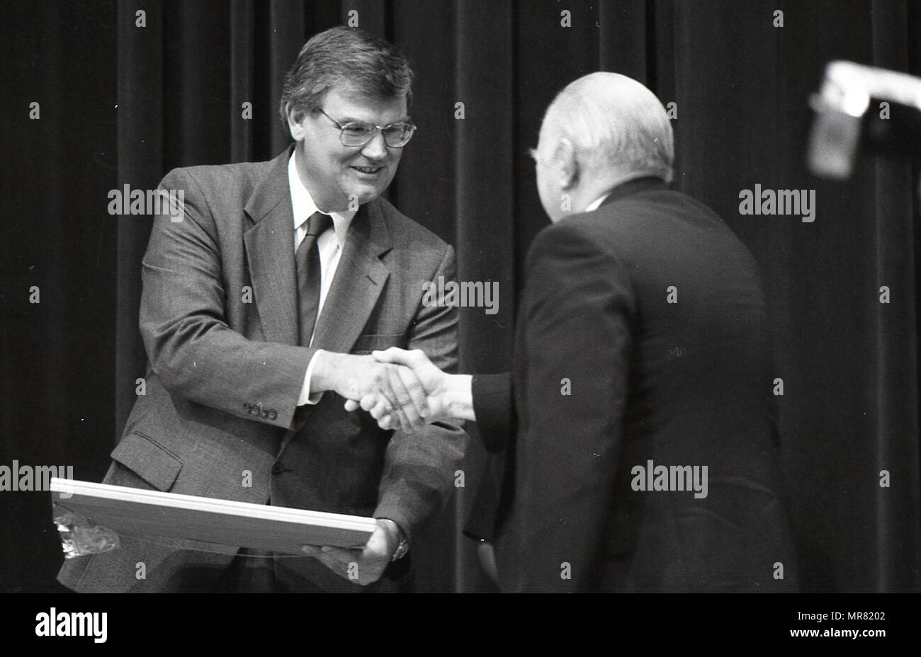 Admin. Atwood presenting general awards - Handshake to receive award ...