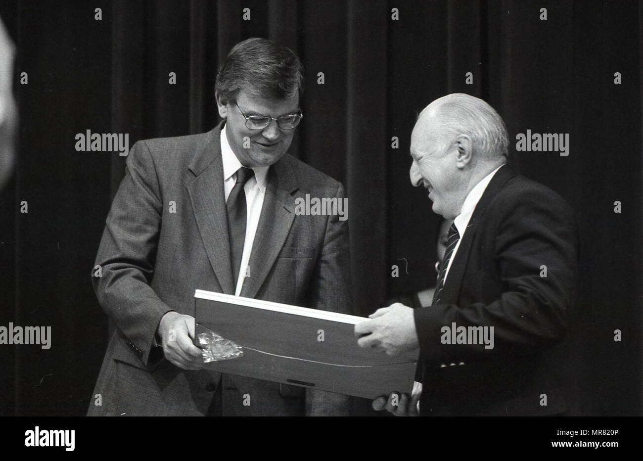 Admin. Atwood presenting general awards - Man receiving award on stage ...