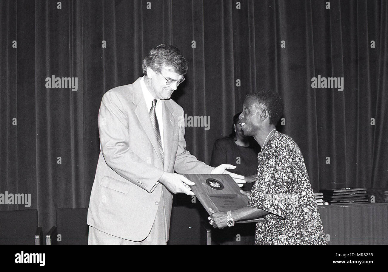 Admin. Atwood presenting general awards - Man receiving award on stage ...