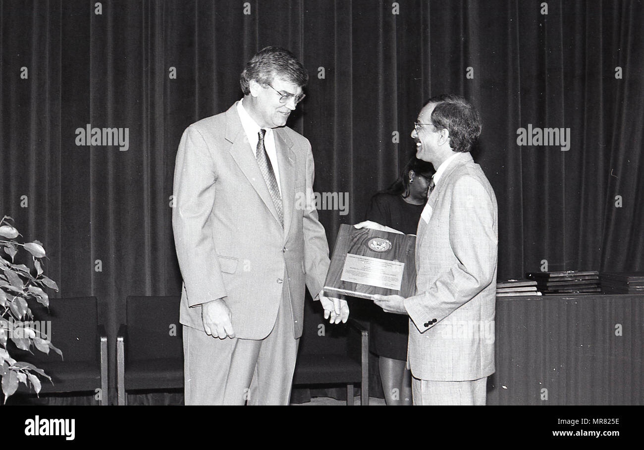 Admin. Atwood presenting general awards - Man receiving award Stock ...