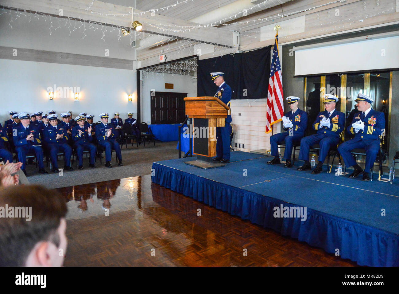 Capt. Kevin Riddle addresses crewmembers and attendees during the Coast ...