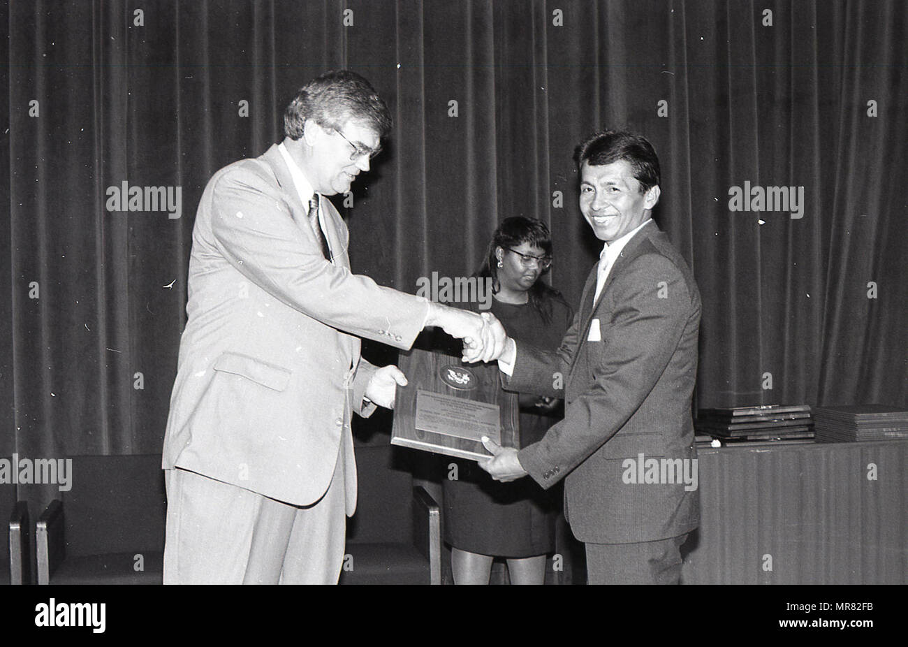 Admin. Atwood presenting general awards - Man receiving award on stage ...