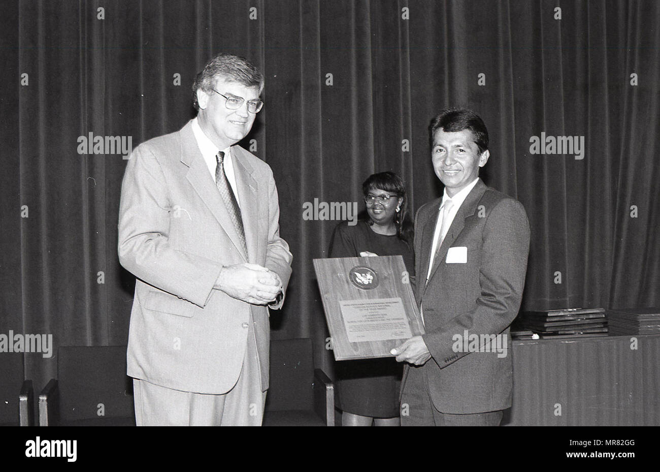 Admin. Atwood presenting general awards - Man receiving award on stage ...