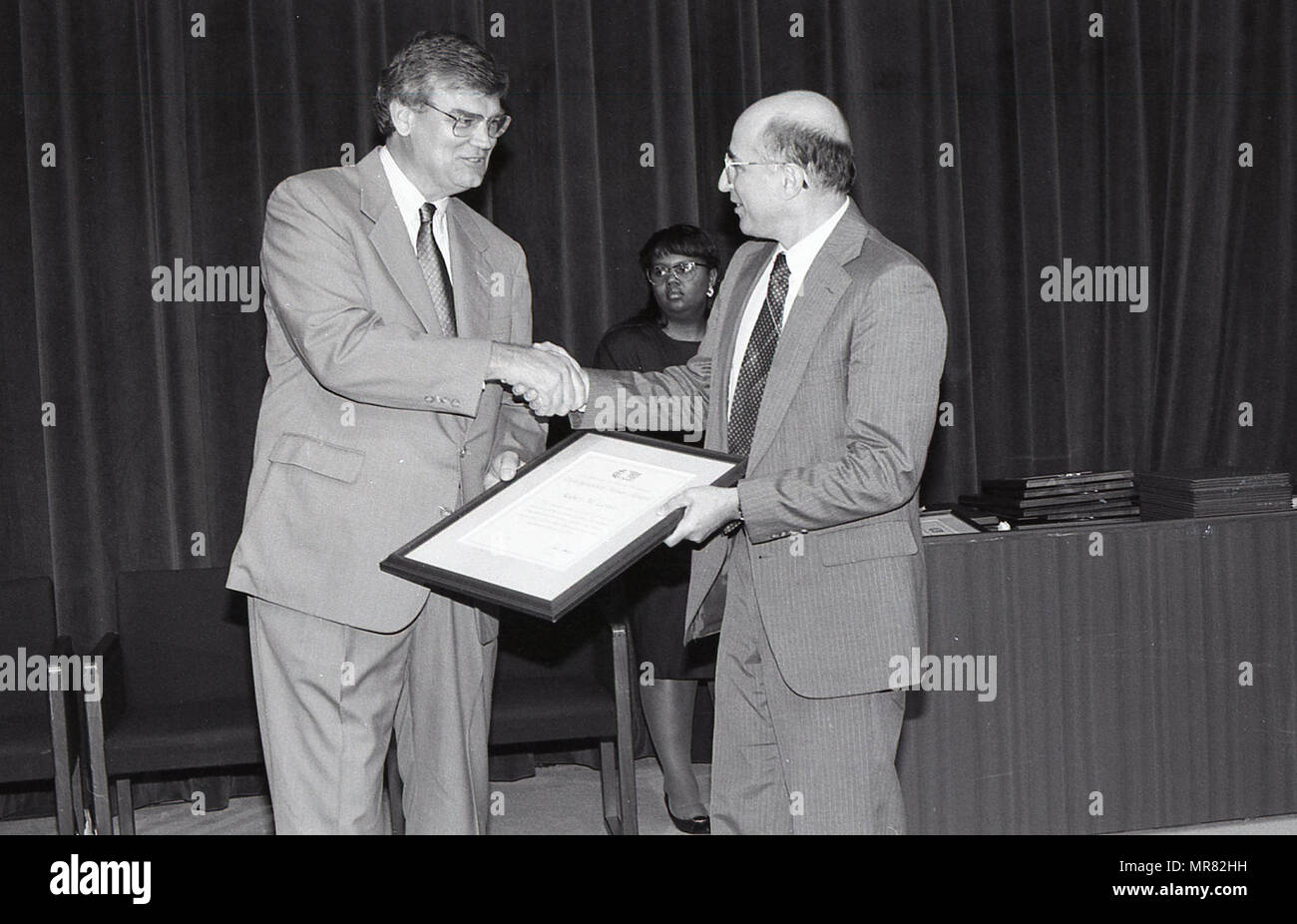 Admin. Atwood presenting general awards - Man receiving award on stage ...