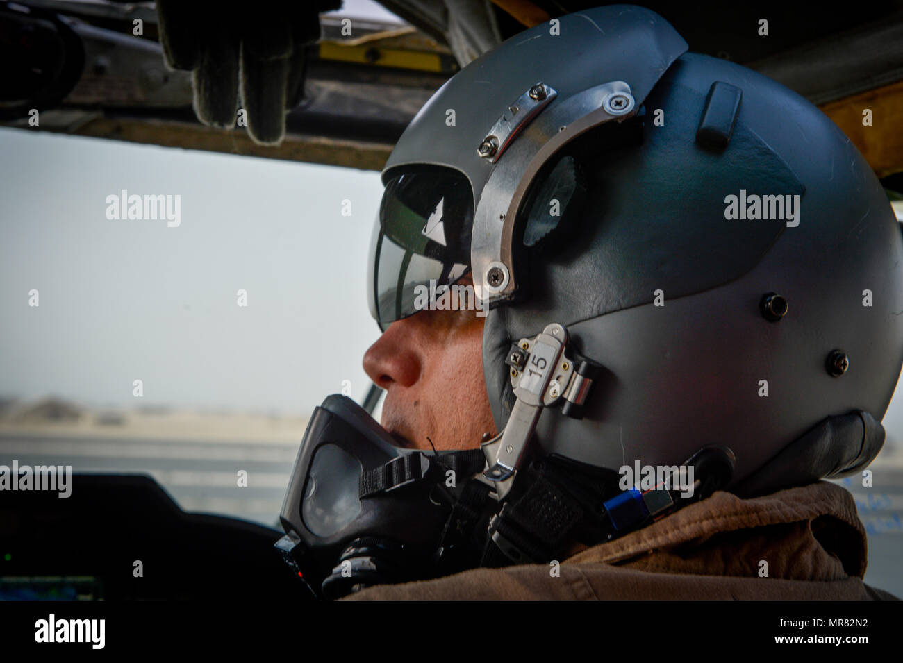 A pilot from the 23rd Expeditionary Bomb Squadron speaks with his co ...