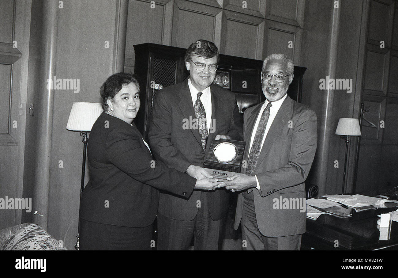 TWO MEN AND WOMAN HOLDING THE AWARD TOGETHER Stock Photo - Alamy