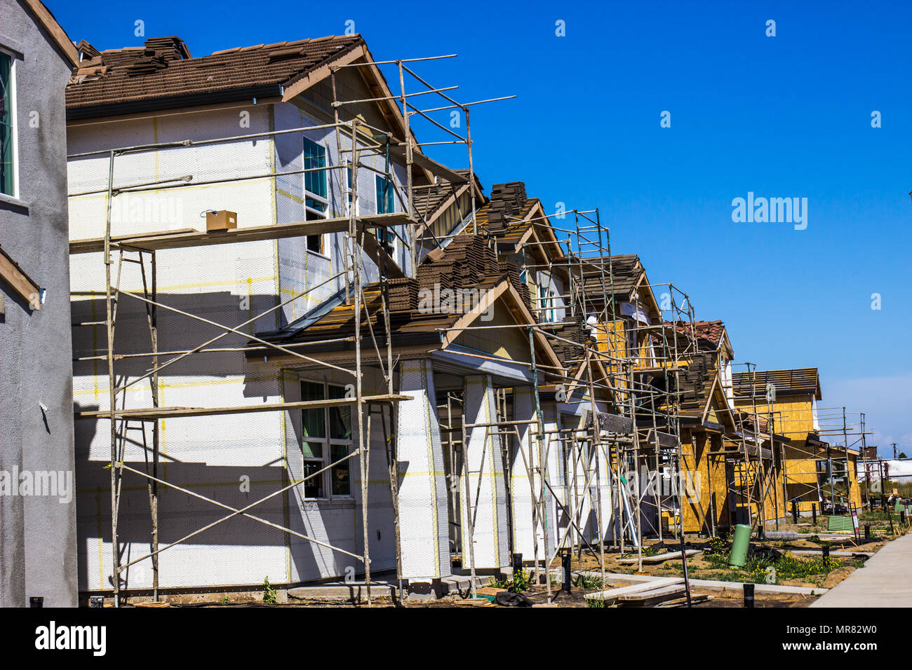 Row Of New Homes Under Construction Stock Photo - Alamy