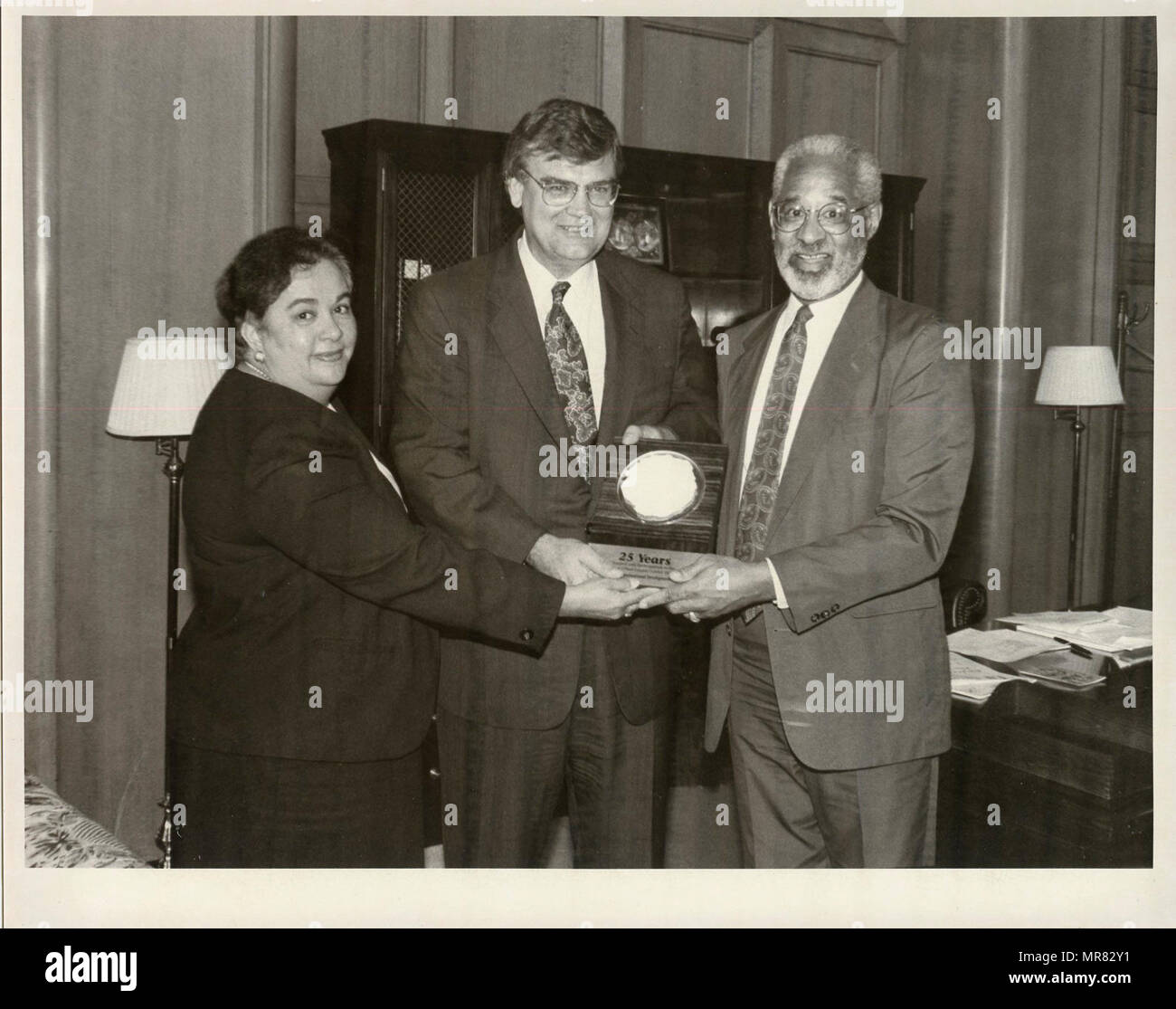 TWO MEN AND WOMAN HOLDING THE AWARD TOGETHER Stock Photo - Alamy