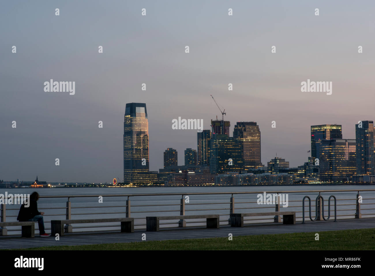 Man sitting at Christopher Street Pier Stock Photo - Alamy