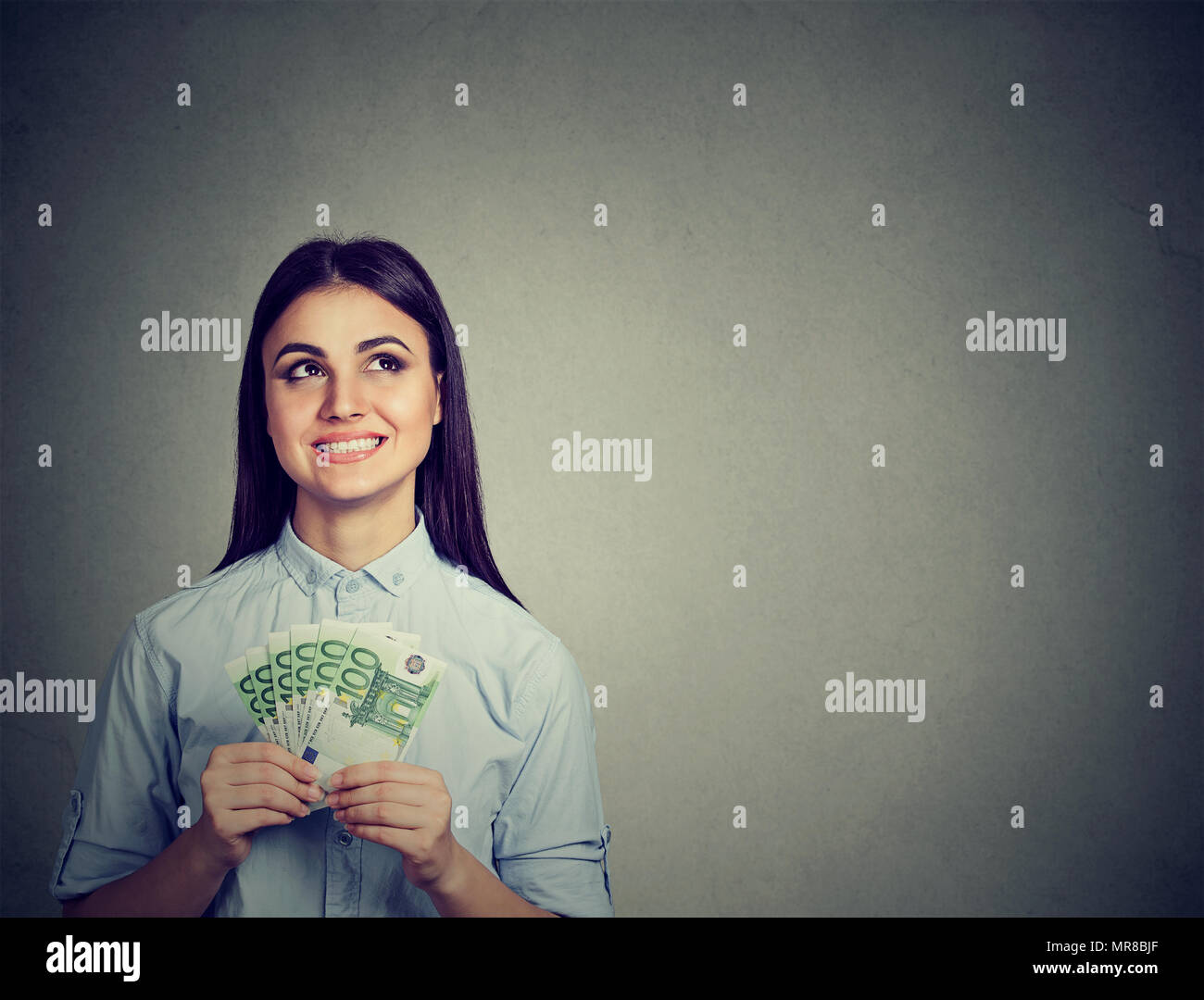 Money thinking hi-res stock photography and images - Alamy