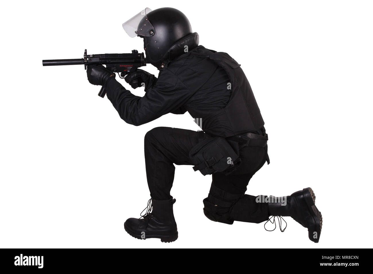 police special forces officer with submachine gun in black uniform ...
