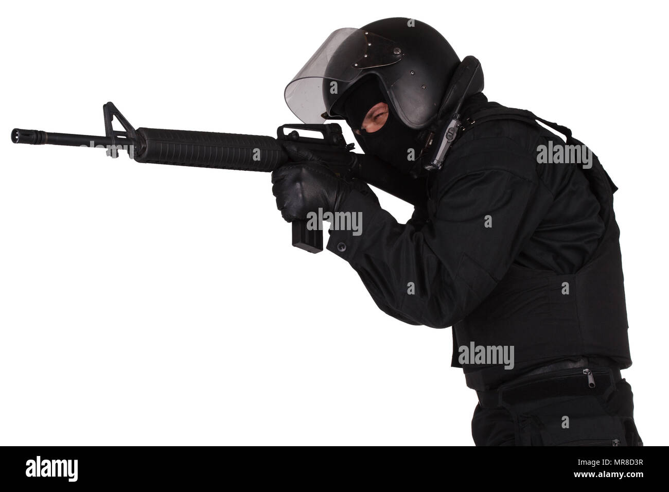 SWAT officer with assault rifle in black uniform isolated on white ...