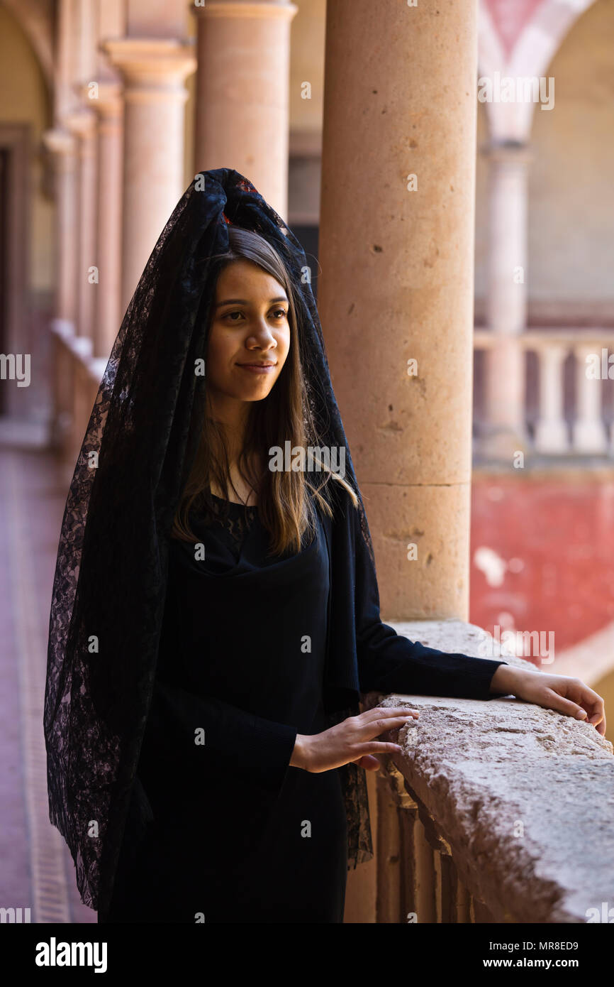 A Mexican woman dressed in a traditional mantilla in preperation to ...