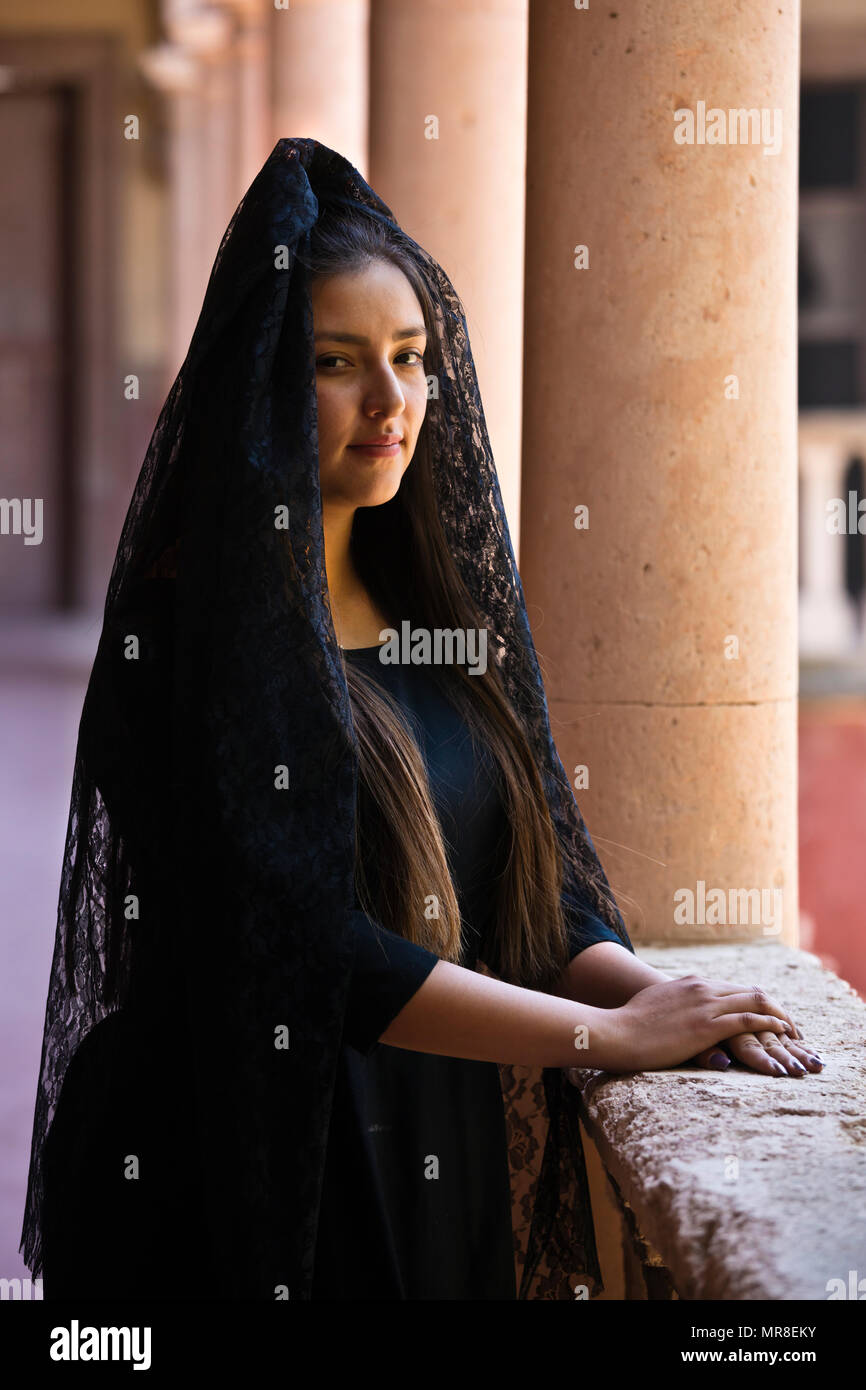 A Mexican woman dressed in a traditional mantilla in preperation to ...