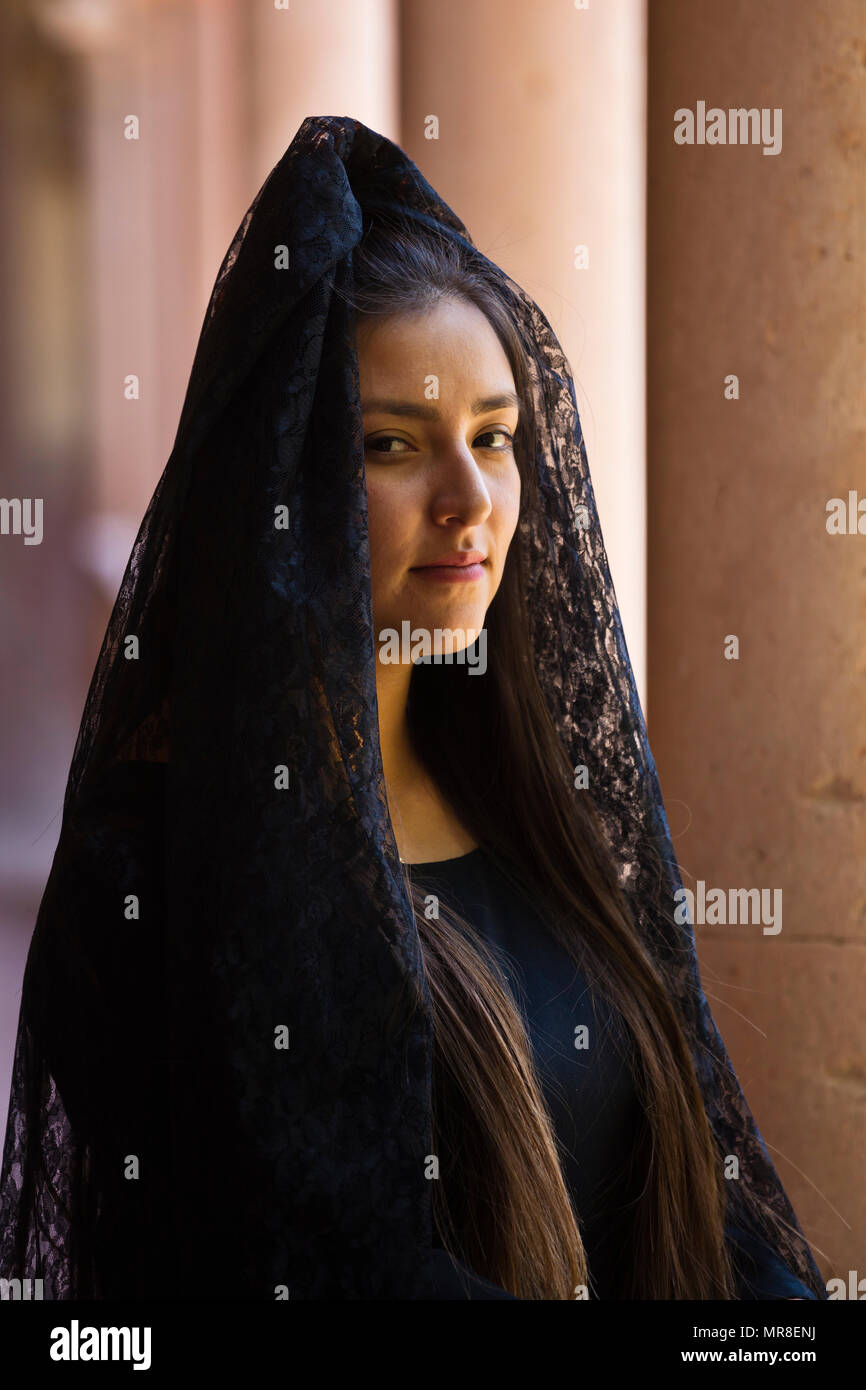A Mexican woman dressed in a traditional mantilla in preperation to ...