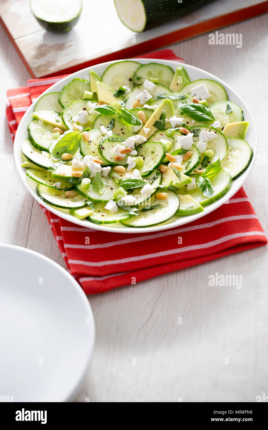 Avocado, courgette cucumber carpaccio with feta cheese and pine nuts ...