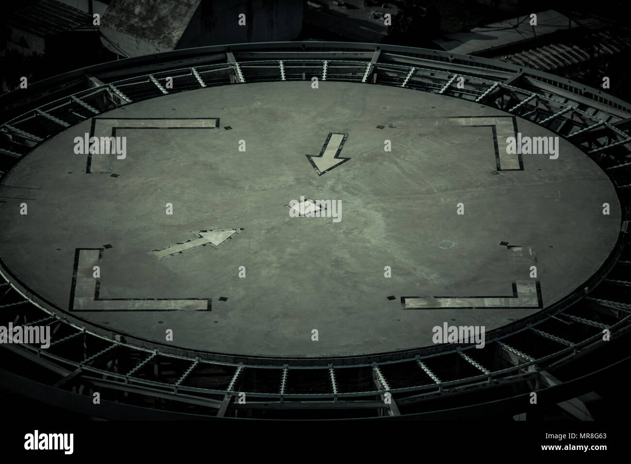 Concrete helicopter landing pad on the top of a building. Shapes of ...