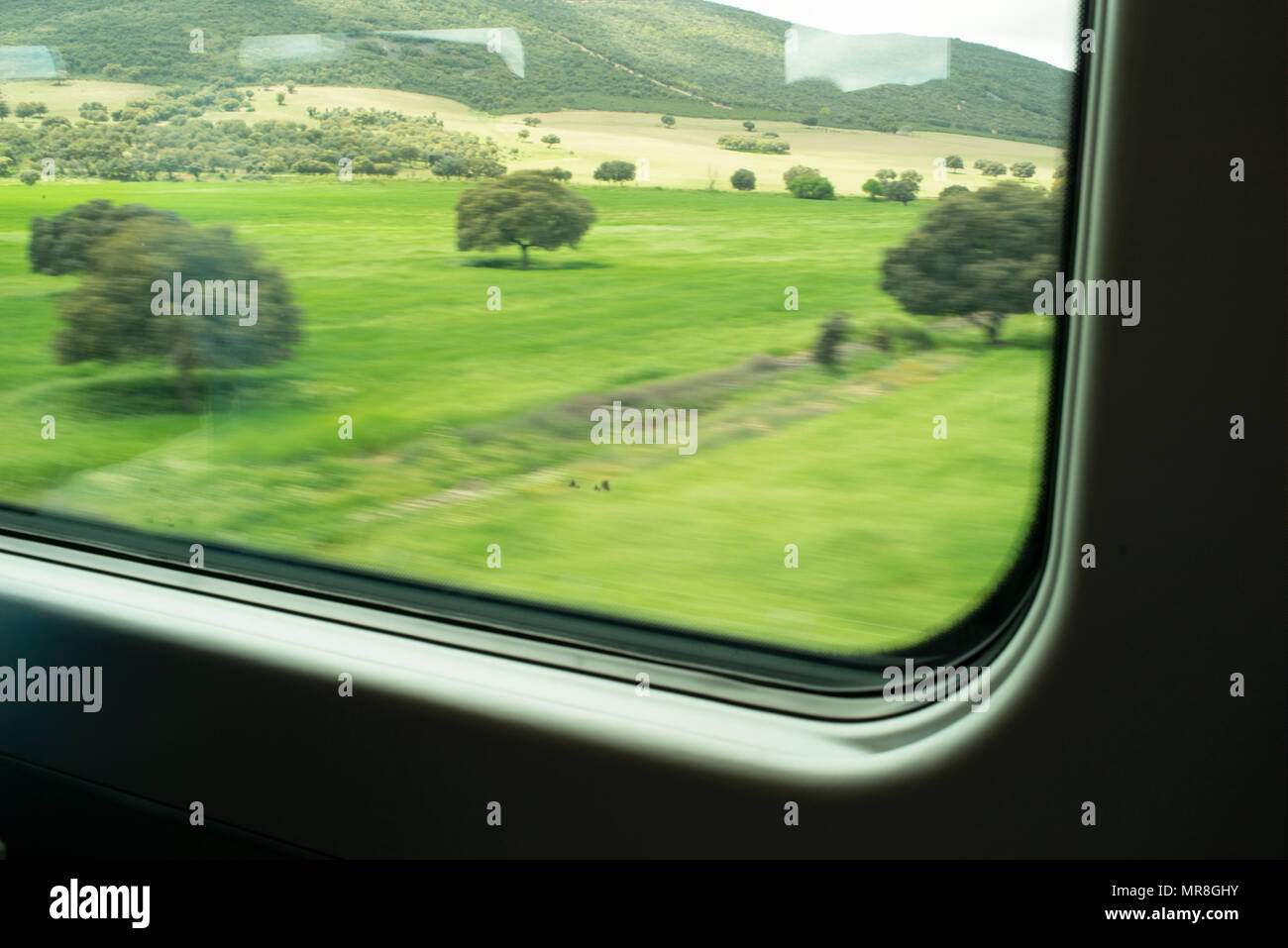 View from high speed train window in motion of countrysideand sky on ...