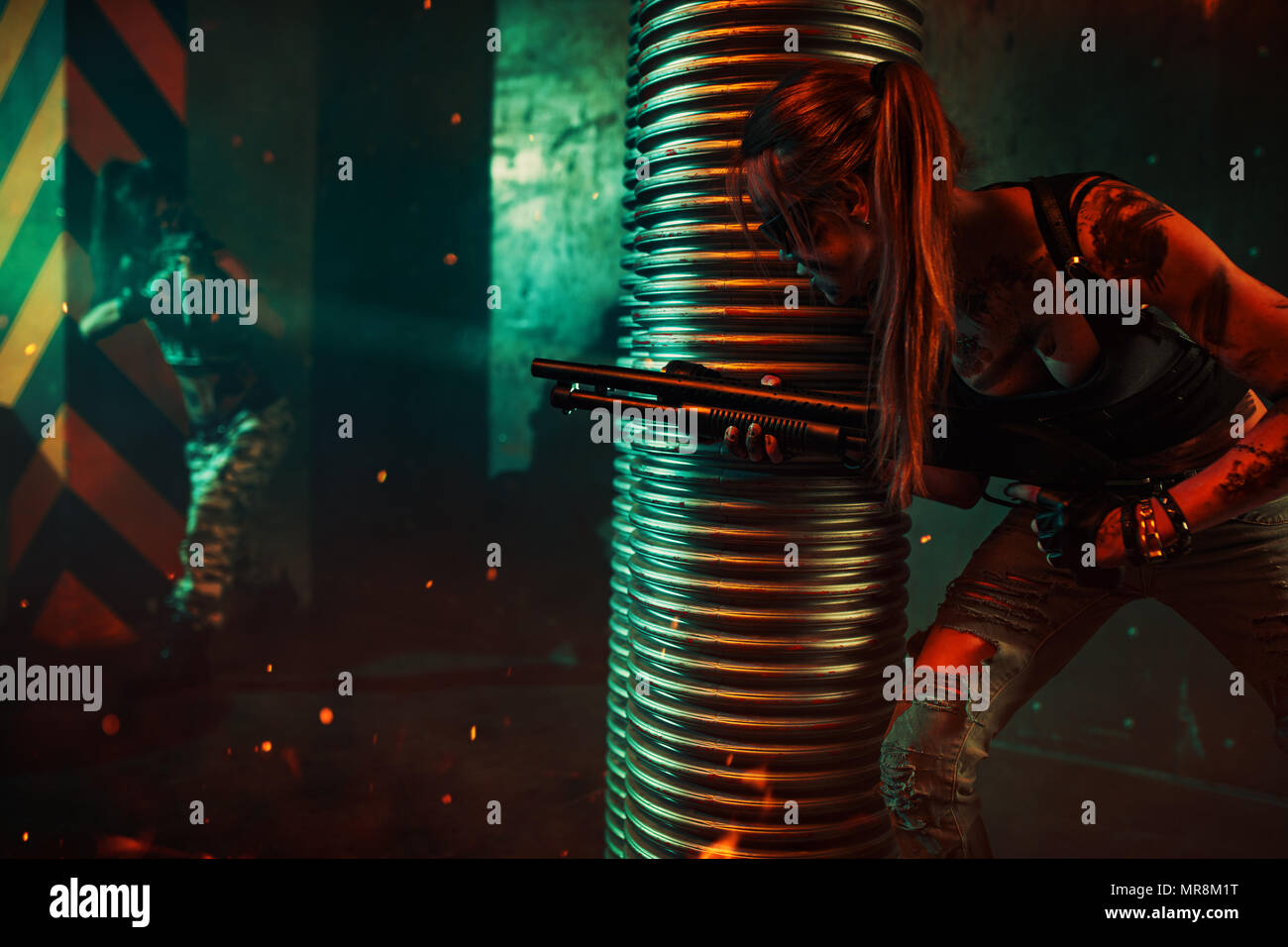 Two women with guns playing in combat scene. Dark dramatic urban ...