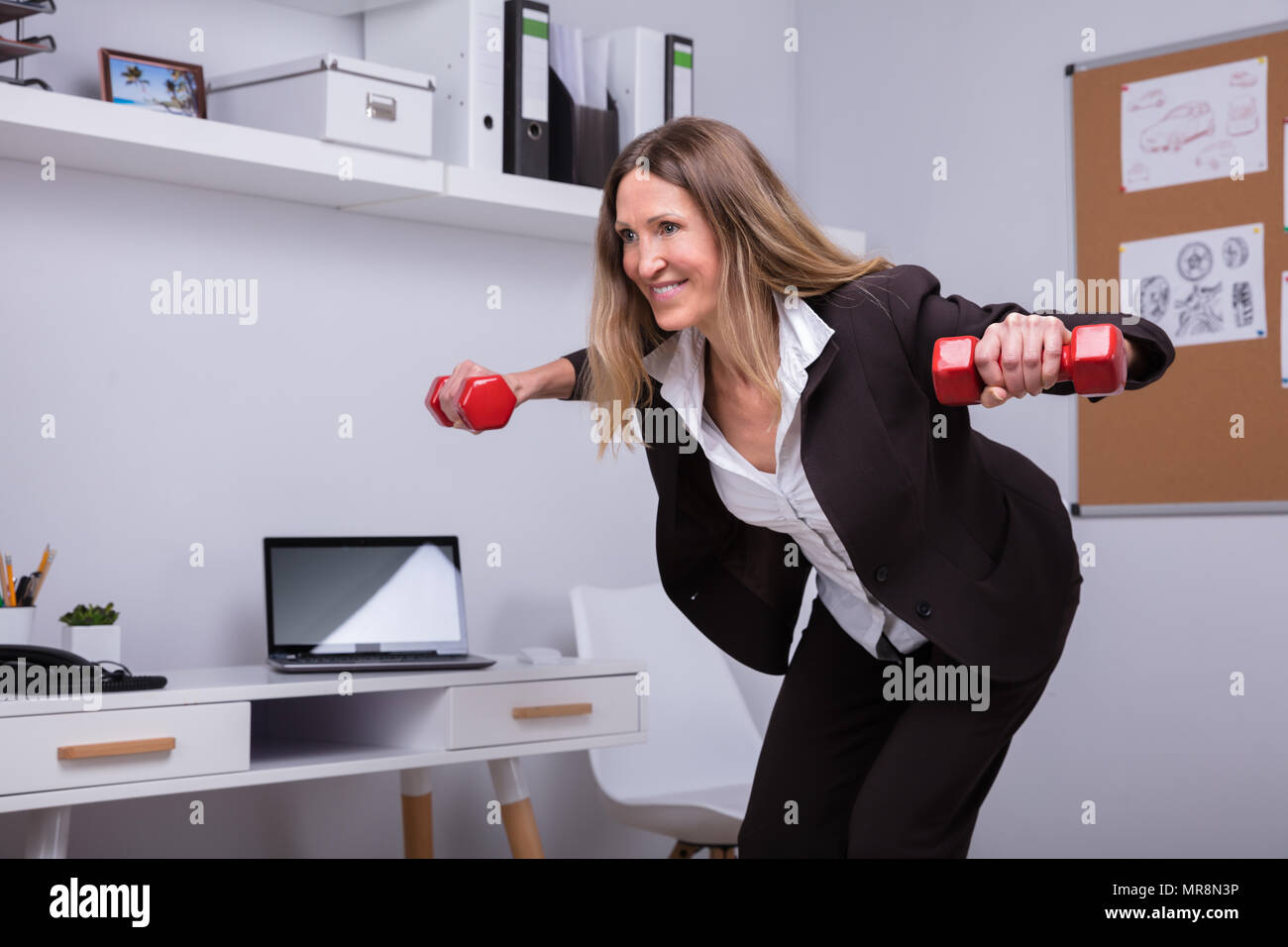 Exercise dumbbell standing hi-res stock photography and images - Alamy