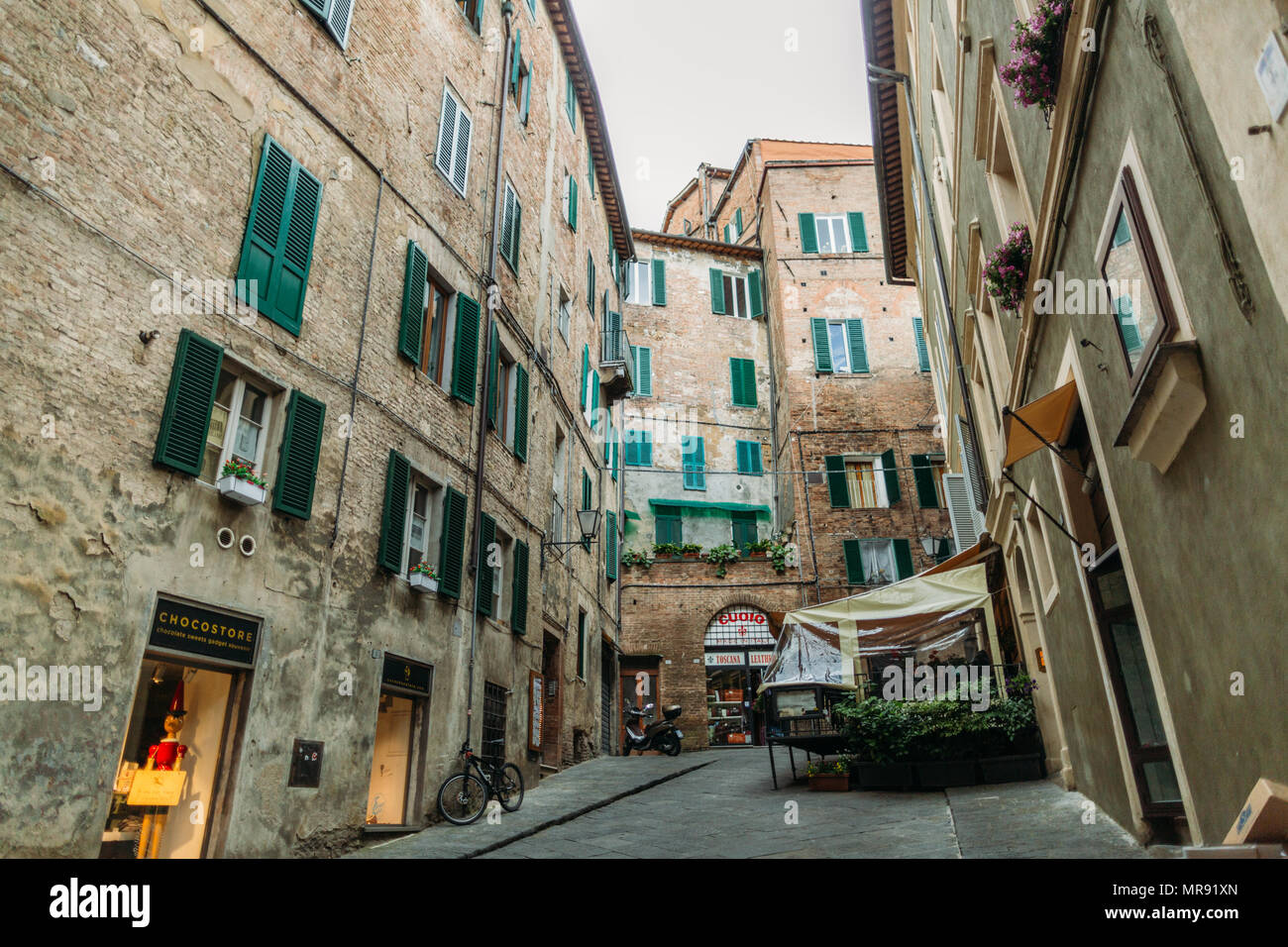 SIENNA, ITALY - 16 MAY 2016: Cafe and shop showcase in historical ...