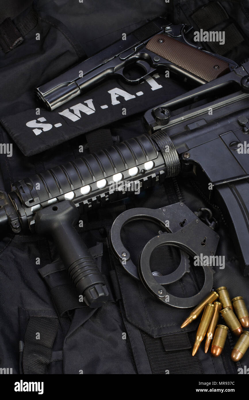 Special weapons and tactics team equipment on black background Stock ...