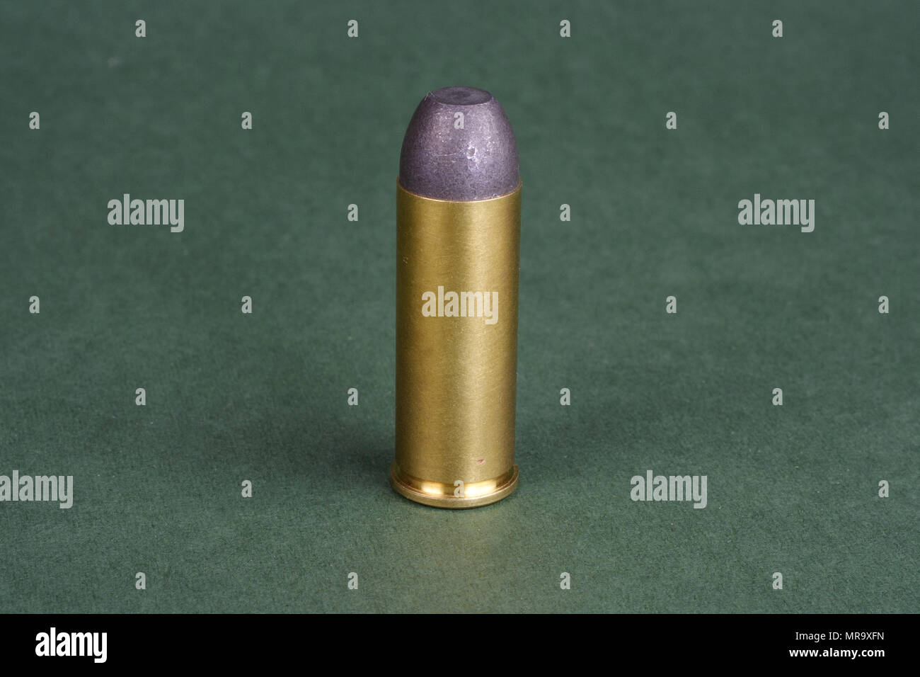 The Wild West period Revolver cartridge dating to 1872 on green ...