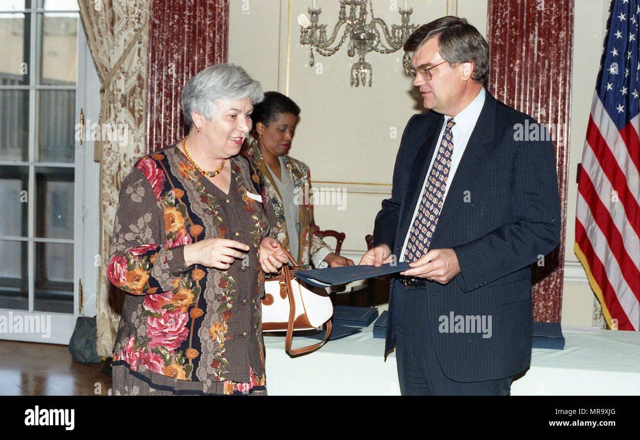 woman accepting award taking a picture Stock Photo - Alamy