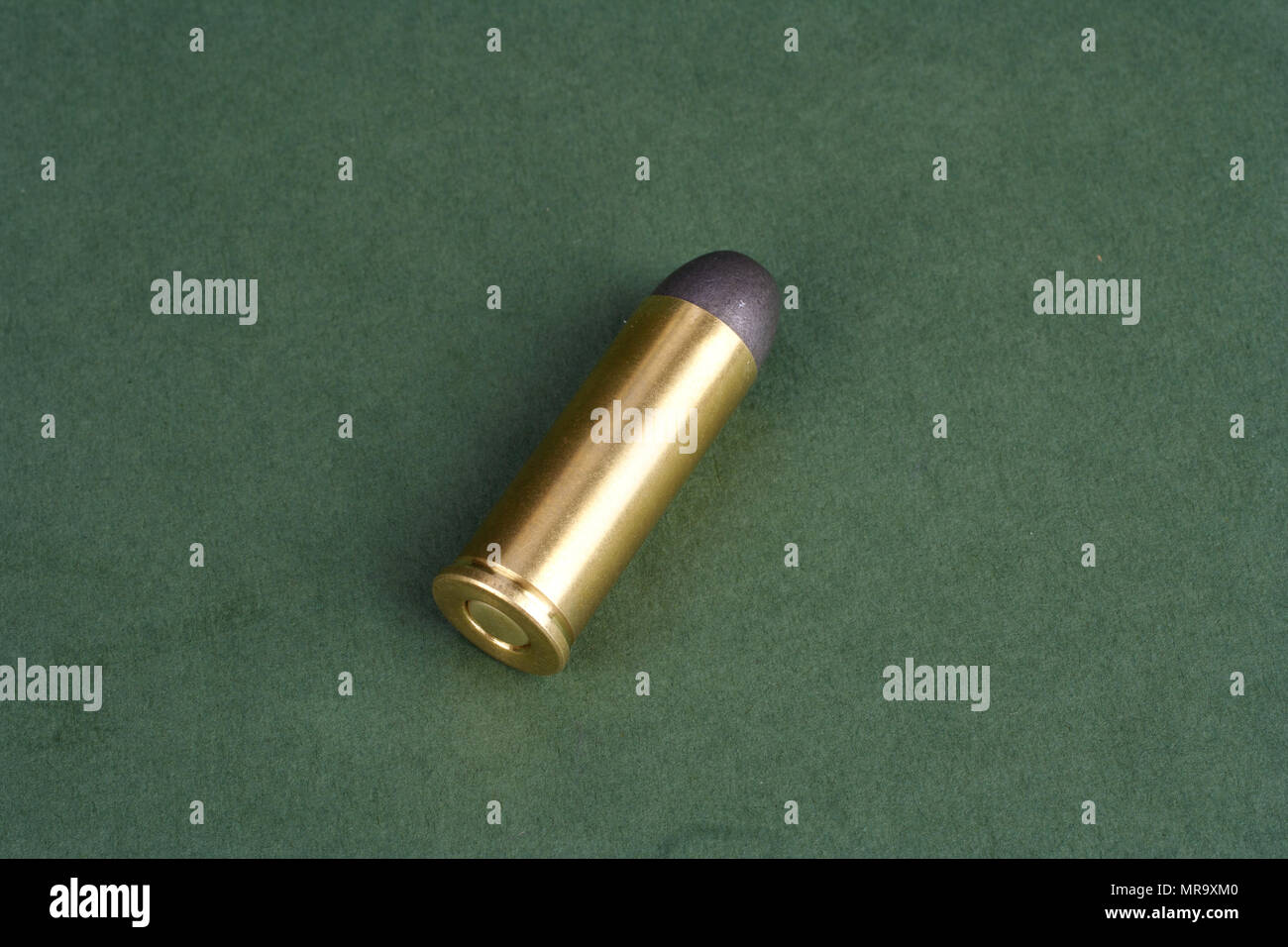 The Wild West period Revolver cartridge dating to 1872 on green ...