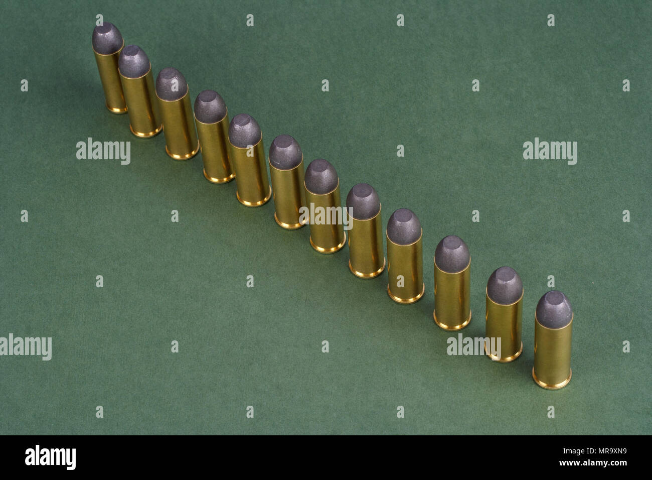 The Wild West period Revolver cartridges dating to 1872 on green ...